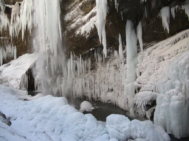 Huge Icicles on Stone Rocks Hang Over the Precipice in the Middle of ...
