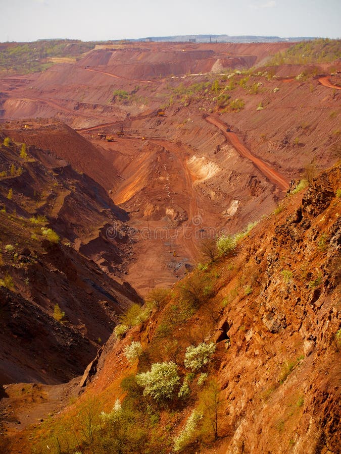 Huge iron open-pit mine stock image. Image of machinery - 70250687