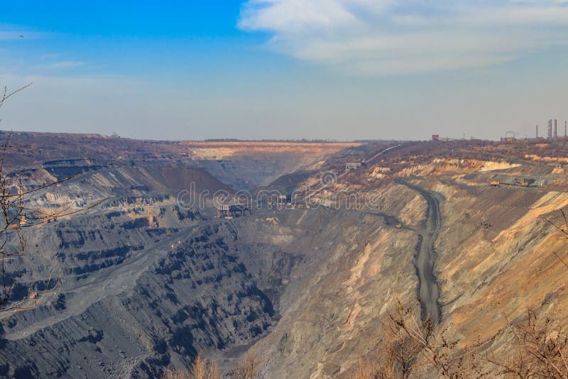 Huge Iron Ore Quarry with Working Dump Trucks and Excavators Stock ...