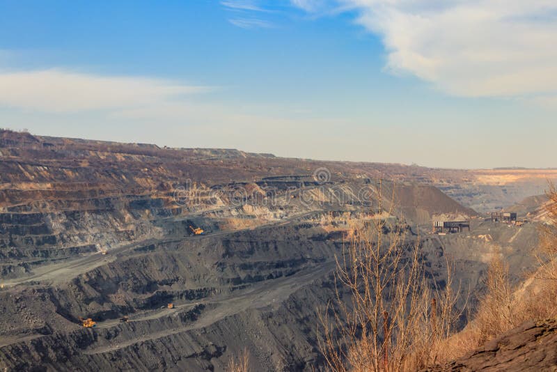 Huge Iron Ore Quarry with Working Dump Trucks and Excavators Stock ...