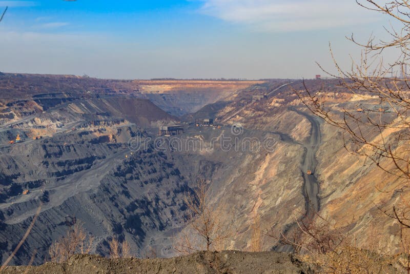 Huge Iron Ore Quarry with Working Dump Trucks and Excavators Stock ...