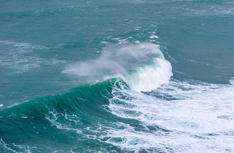 Wave breaking in the rocks stock photo. Image of europe - 138062378