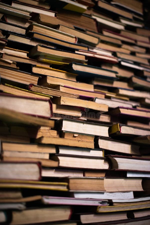 A Huge Pile of Different Books in the Library. a Library Full of Books ...