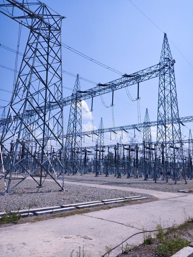 Huge Power Substation. High Voltage Electric Tower on Sky Background ...