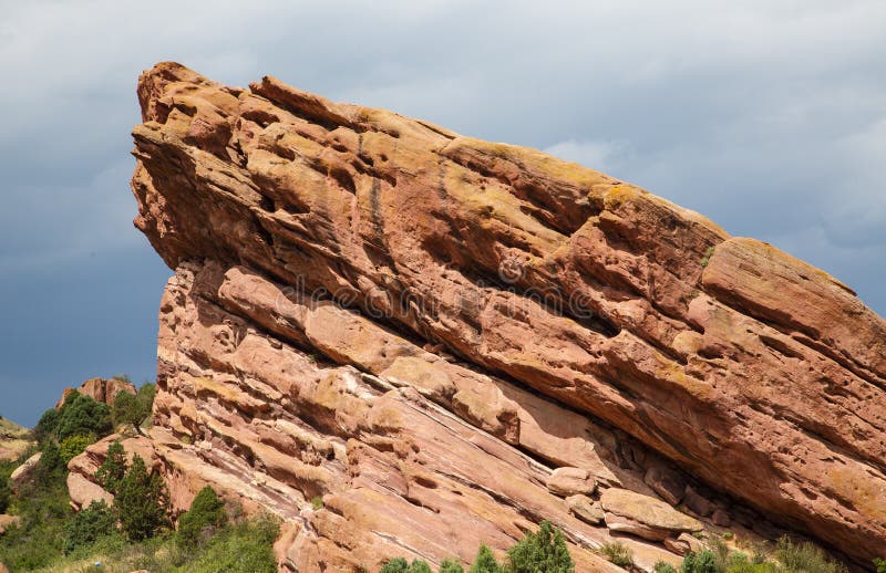 Huge Red Boulder Under Cloudy Sky Stock Image - Image of rocky, desert ...