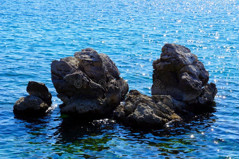 Huge Rocks from the Seabed Rise Above the Surface of the Water Stock ...