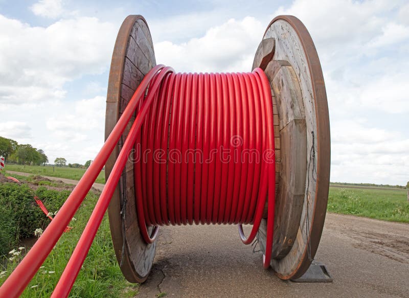 A Big Roll of Cable and Electricity Poles Stock Image - Image of ...