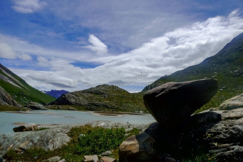 Huge Single Rock at a Mountain Lake while Hiking in the Summer Stock ...