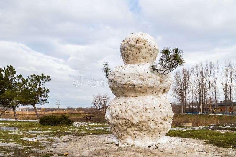 Huge Spring Snowman in Melted Meadow. Background with Copy Space for ...