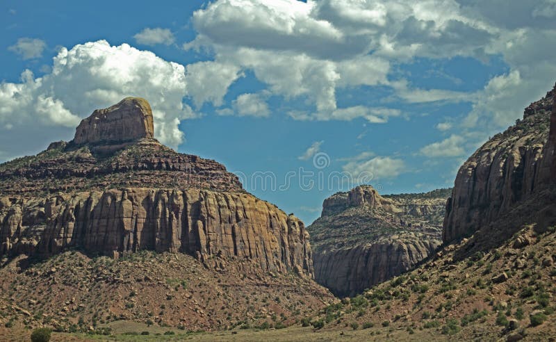 Massive Monuments in the Desert Sand Under a Blue Sky. Stock Image ...
