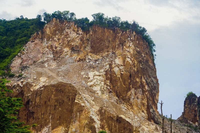 Huge Stone Mountain with Trees. Massive Rock Wall. High Mountain Cliffs ...