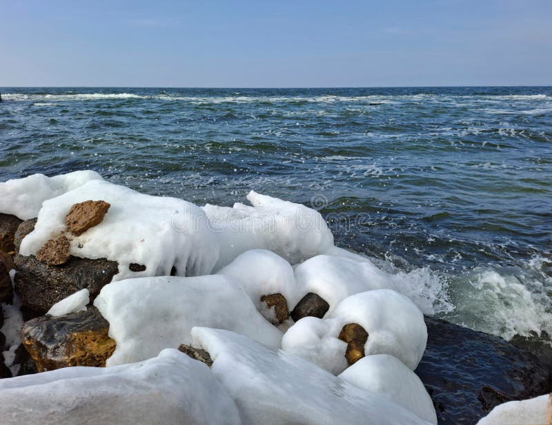 Icy rocks on the beach stock image. Image of coast, ocean - 364684765
