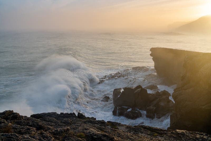 Huge Storm Surge Ocean Waves Crashing Onto Shore and Cliffs at Sunrise ...