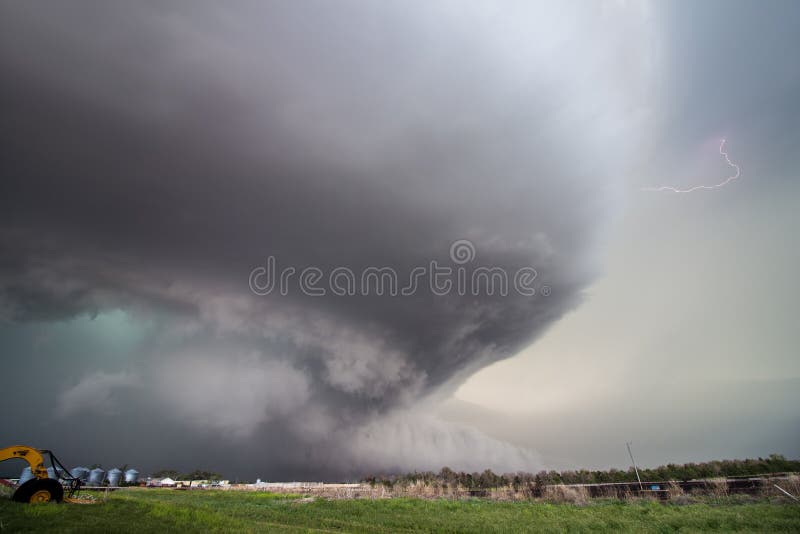 A Huge Supercell Storm with a Ground Scraping Wall Cloud and Lightning ...