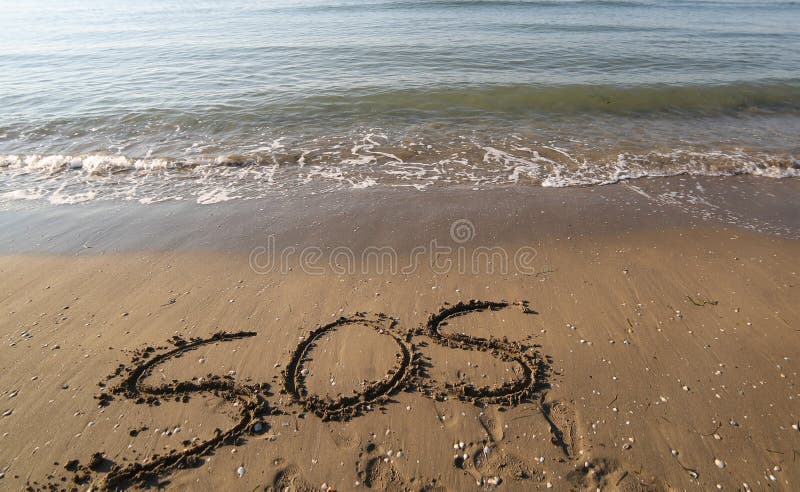 Sos in sand stock image. Image of note, ocean, beach - 13929873