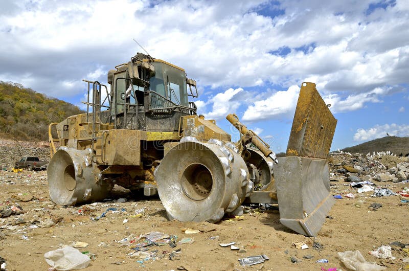 Huge Tractor Moving Trash Dump Stock Photos - Free & Royalty-Free Stock ...