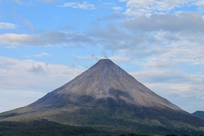 Huge Volcanic Mountain with Blue Sky in the Background Stock Photo ...