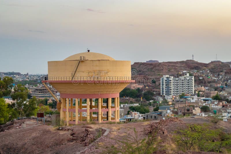 Huge Water Tank and City House Construction and Mountain Background at ...