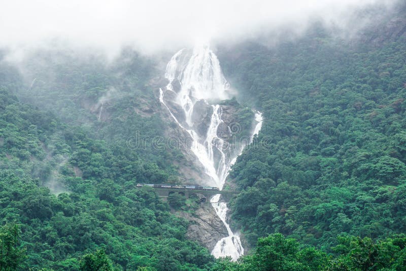 The Huge Waterfall Dudhsagar and the Railway Bridge Passing through it ...