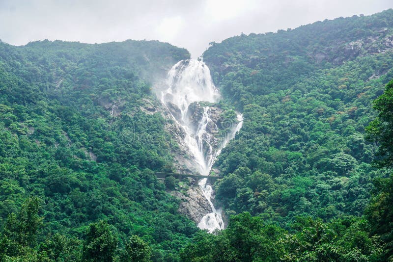 The Huge Waterfall Dudhsagar and the Railway Bridge Passing through it ...