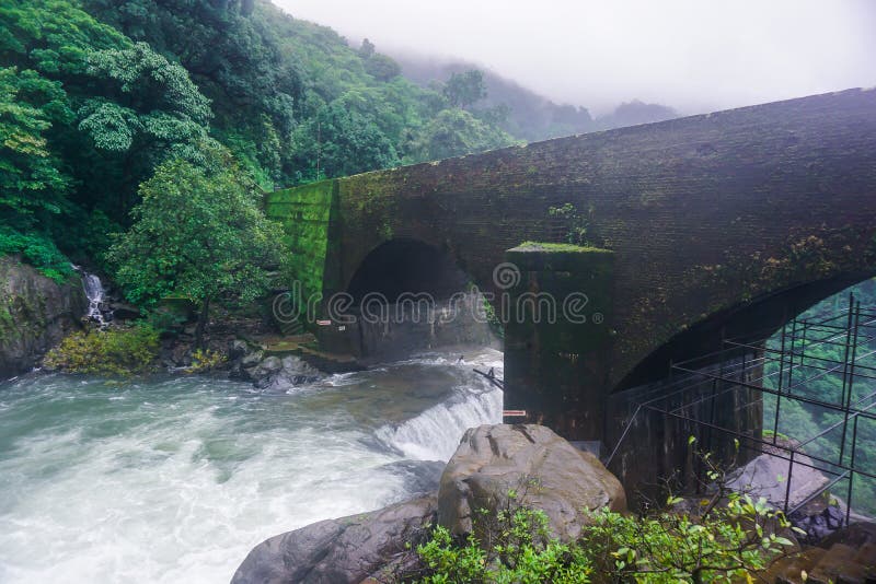The Huge Waterfall Dudhsagar and the Railway Bridge Passing through it ...