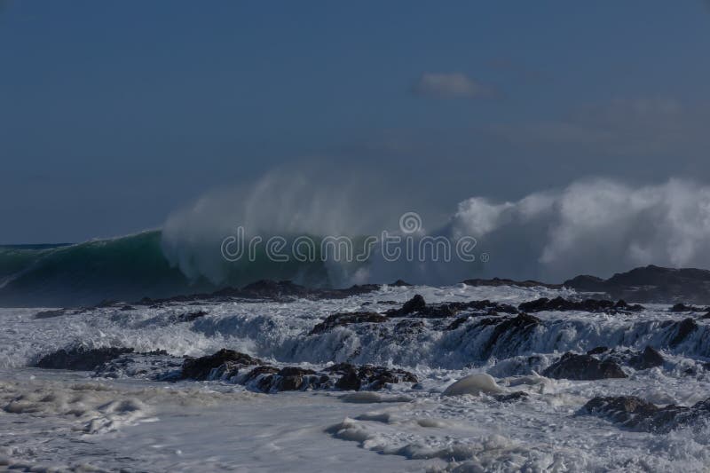 A Huge Wave, Cyclone Driven, Breaks and Trails Wind Blown Spray. Stock ...