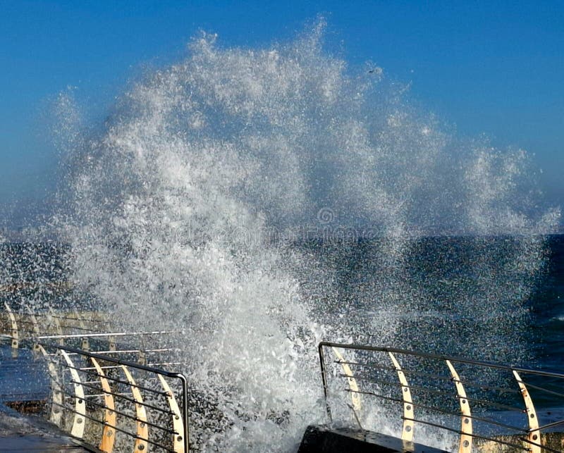 Huge wave on the pier stock photo. Image of wave, travel - 351254668