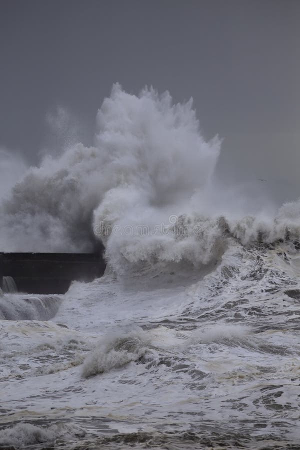Huge wave splash over pier stock photo. Image of danger - 177619778