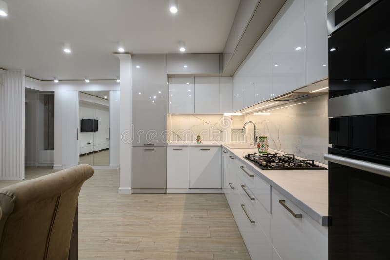 Huge White Luxury Kitchen in a Studio Apartment Interior Stock Photo ...