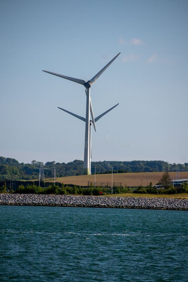 Huge Windmills on a Field Near a Coast Stock Photo - Image of generator ...