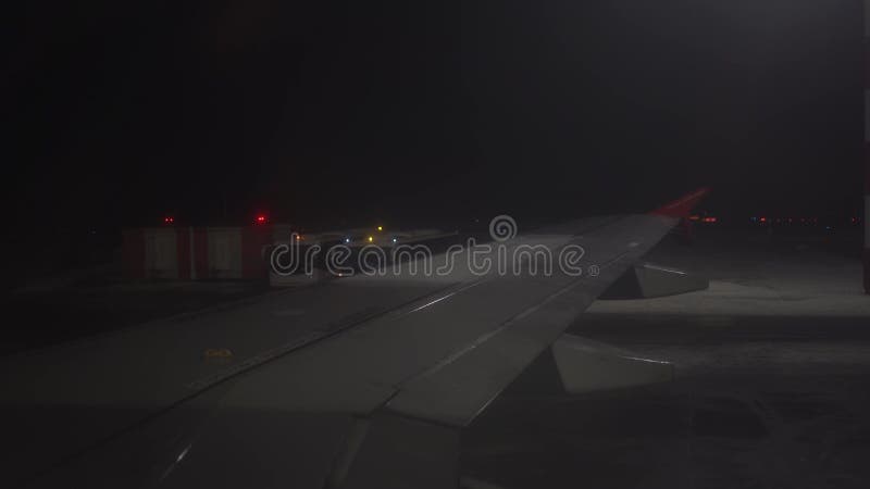 The Huge Wing of the Passenger Plane is Visible from the Illuminator. a ...