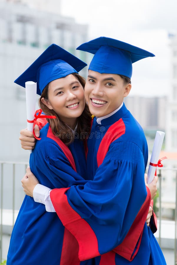 Cheerful Graduates in University Campus Stock Photo - Image of young ...