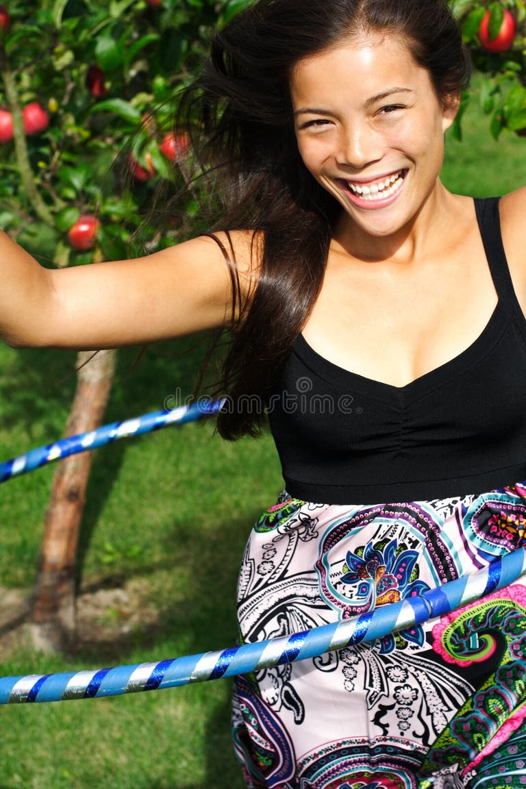 Young Sporty Woman Doing Hula Hoop Exercise Outdoor Stock Photos - Free ...