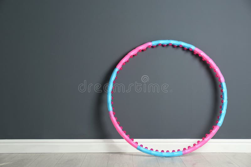 Hula Hoop Near Grey Wall in Gym. Space for Text Stock Photo - Image of ...