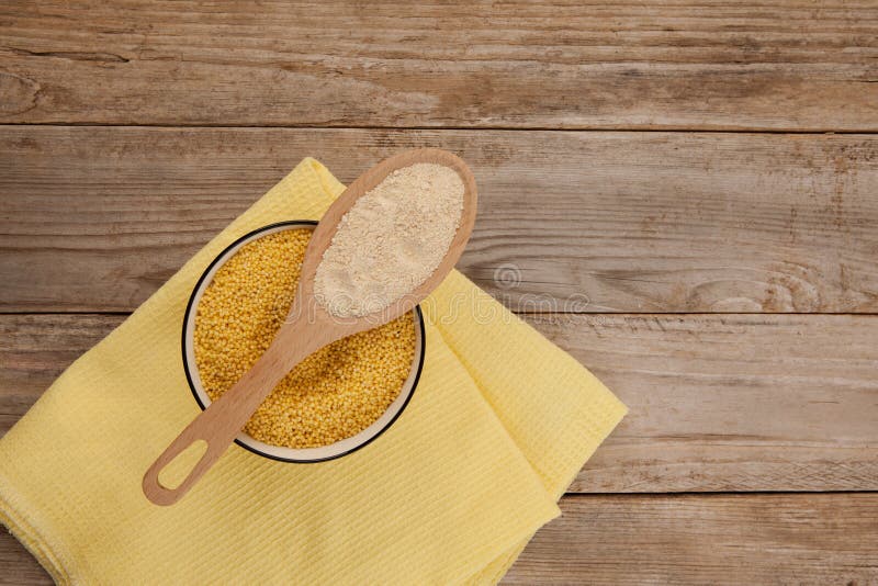 Hulled Millet Flour and Grain in Bowl on Old Wooden Table, Top View ...