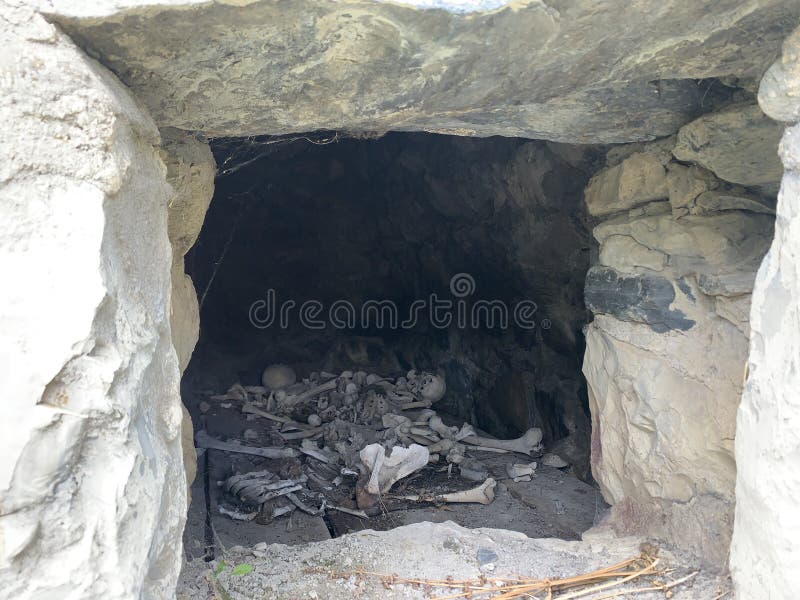 Human bones inside crypt stock photo. Image of dead - 254236132