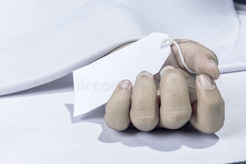 Human Corpse Covered with a Sheet and Name Tag on Hand Stock Image ...
