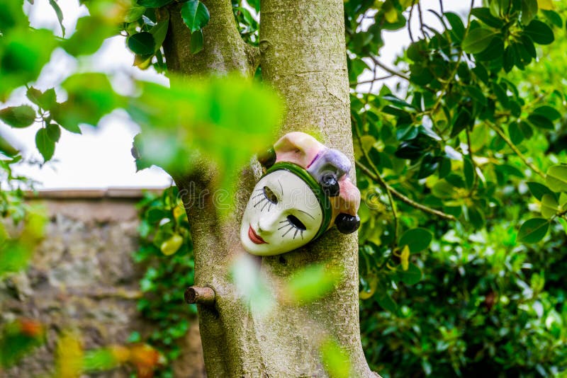 Human Face Baked Clay Mask on a Tree in a Garden Stock Image - Image of ...