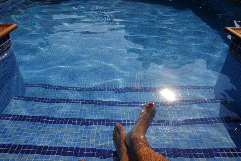 Human feet in a pool stock photo. Image of legs, space - 42920006