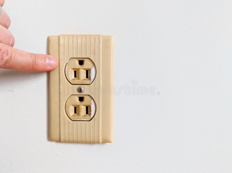 Finger Pointing at Old Electrical Wall Plug Stock Image - Image of plug ...