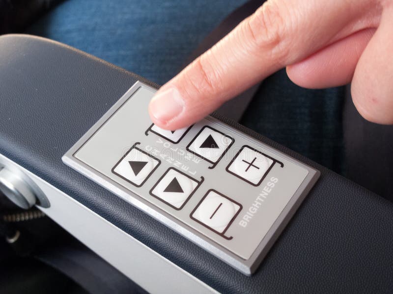 Human Finger Pressing Push Buttons on the Armrest Stock Image - Image ...