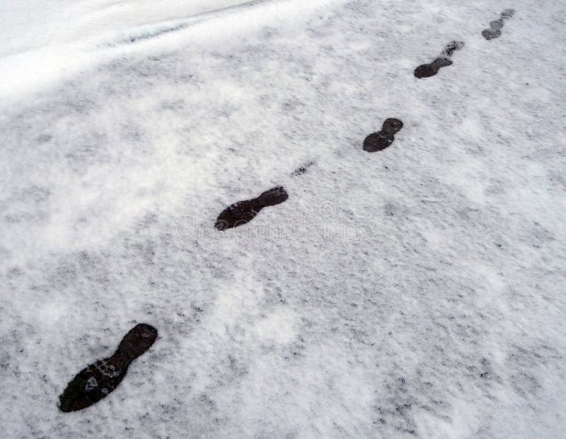 Human foot prints in snow stock photo. Image of stamp - 297433586