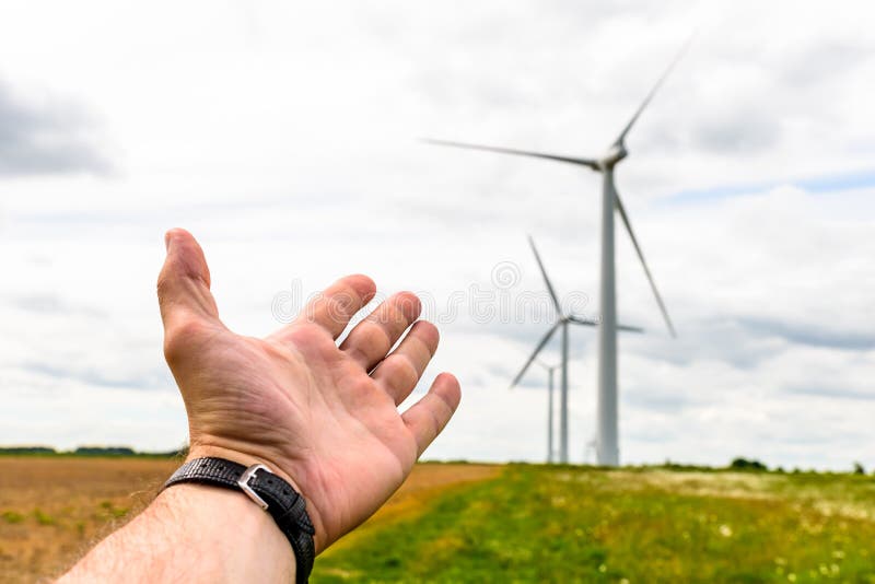 Human Hand Aiming To Wind Power Turbines Generate Electricity Stock ...