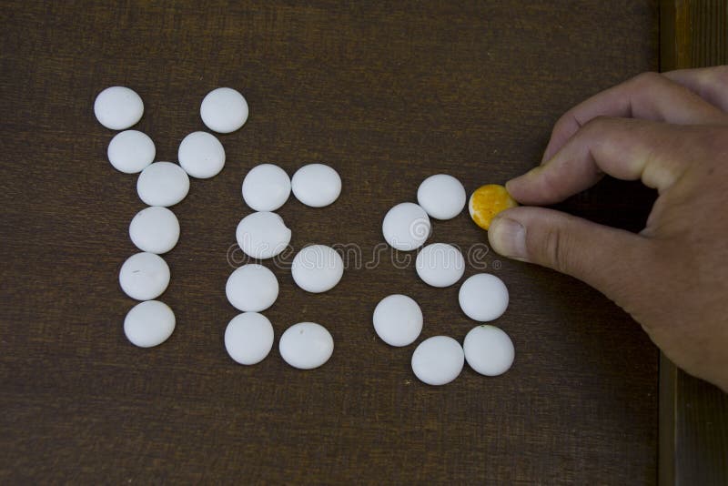 Hand and Yes stock image. Image of pebbles, wooden, sign - 125216081