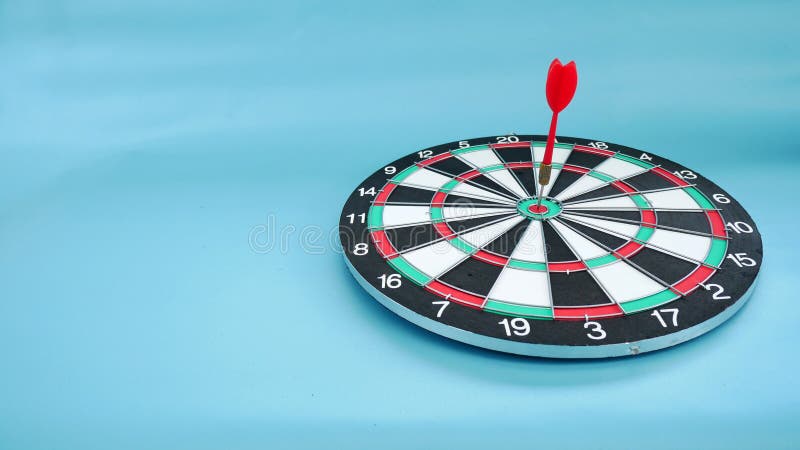 The Human Hand and Arrow Hit the Center of the Target Board. Stock ...