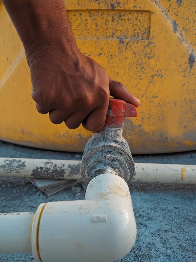 Human hand on a ball valve stock image. Image of valve - 237929131