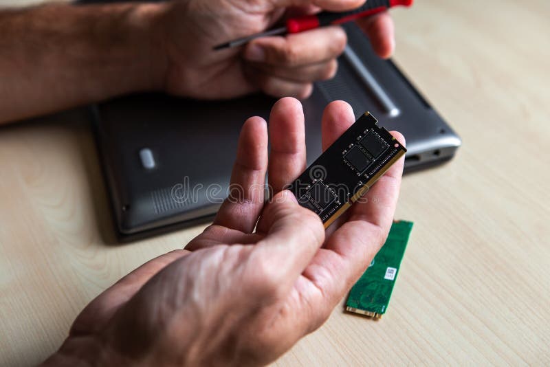 A Human Hand with a Computer Memory Frame. he Wants To Install it in ...