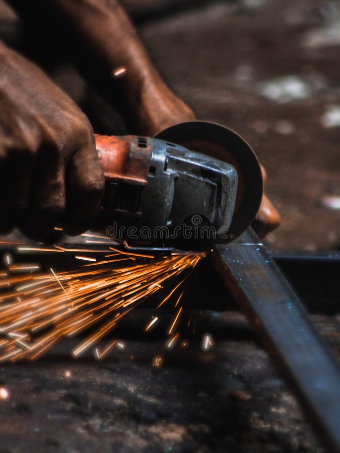 Human Hand is Cutting Iron with a Grinder. Stock Image - Image of ...