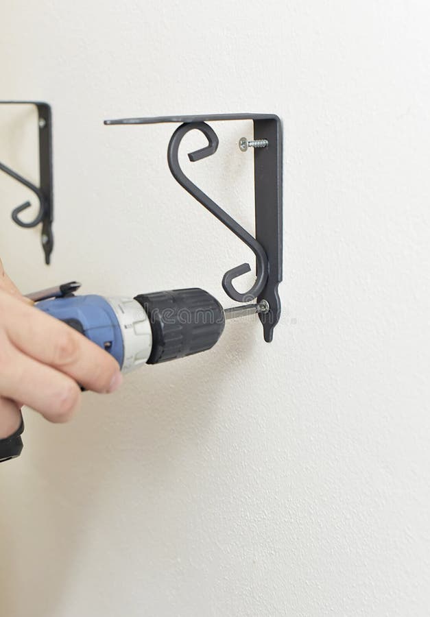 People Hand Drilling into Apartment Wall with Cordless Drill. Stock ...
