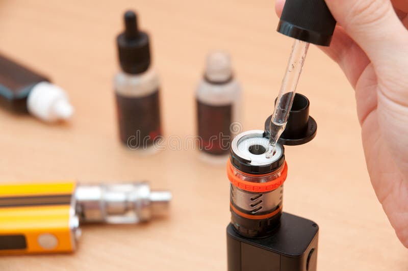 Human Hand Filling E-liquid in Vaping Atomizer Stock Image - Image of ...